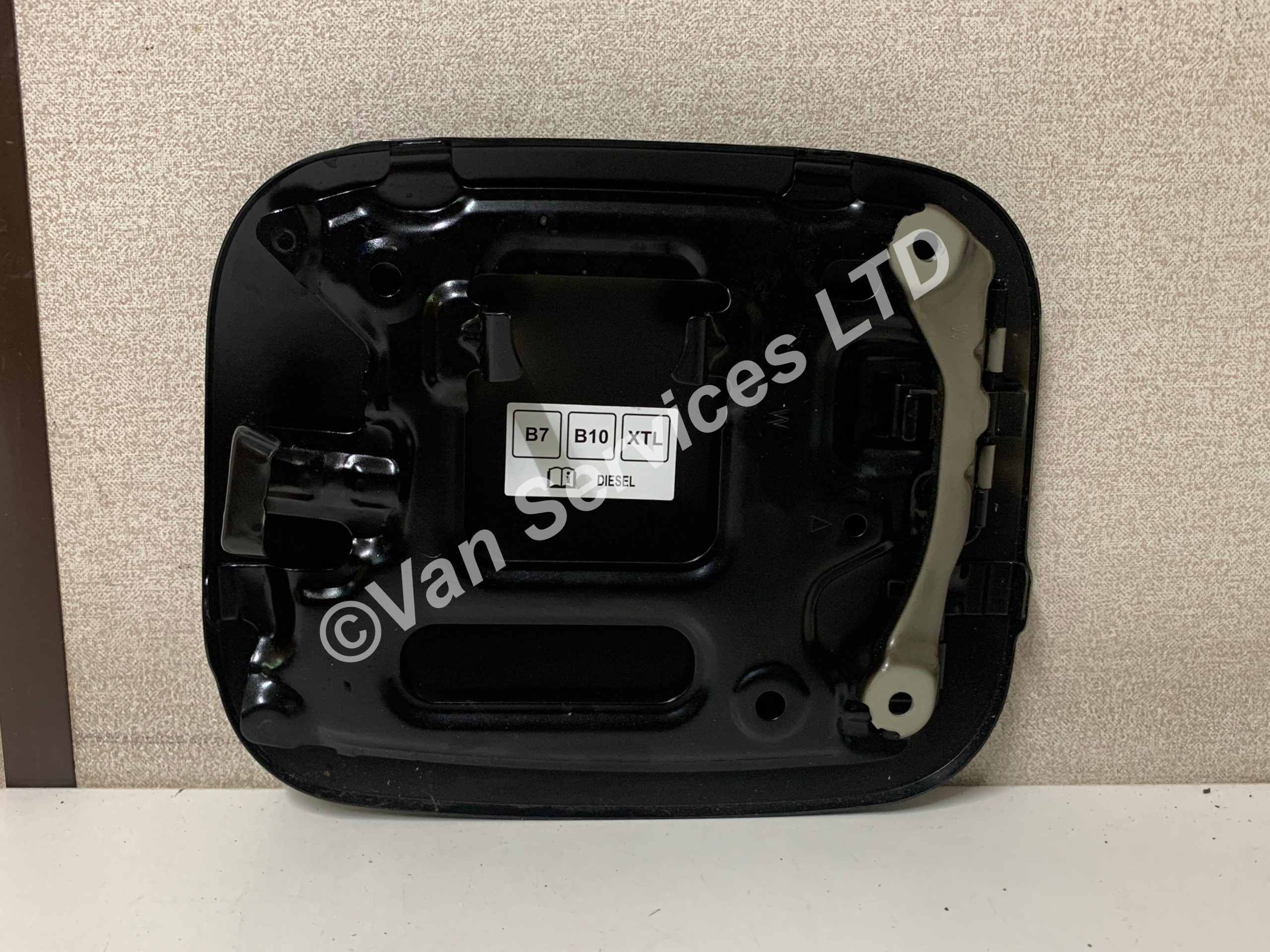 GENUINE TOYOTA HILUX FUEL FLAP – BLACK – FITS 2016-23 – Van Services Ltd